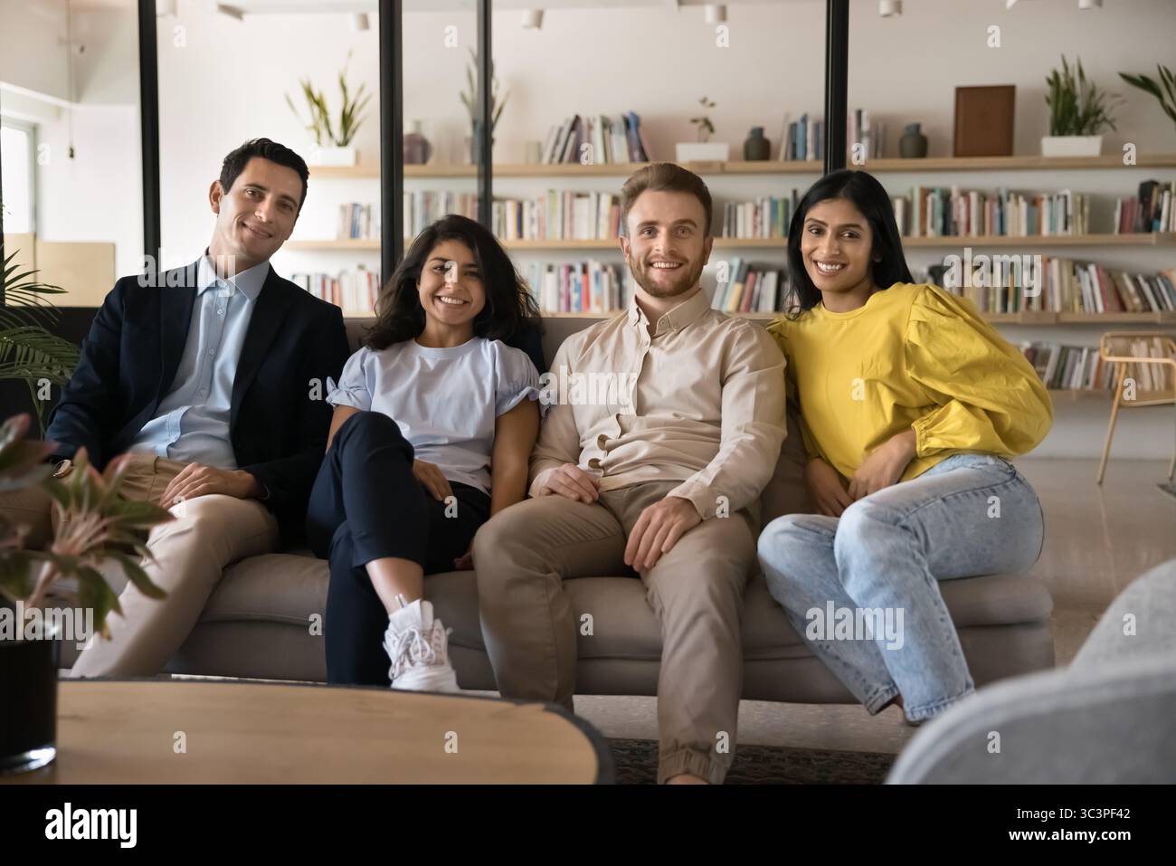 Staff smiling at camera, posing for photo in coworking office Stock ...