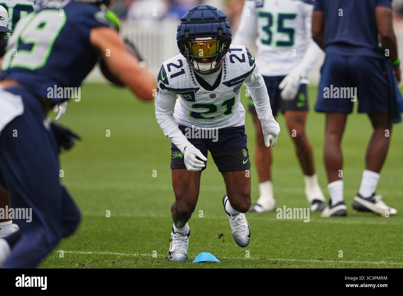 Seattle Seahawks cornerback Devon Witherspoon runs a drill during the ...