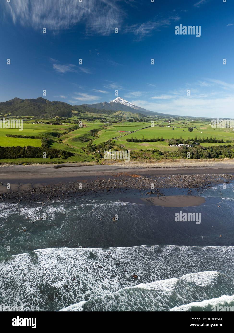 Aerial view of the beach and green fields around Mt. Taranaki, New ...