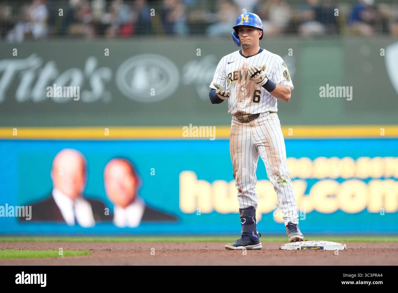 Milwaukee Brewers' Isaac Collins gestures after hitting an RBI double ...