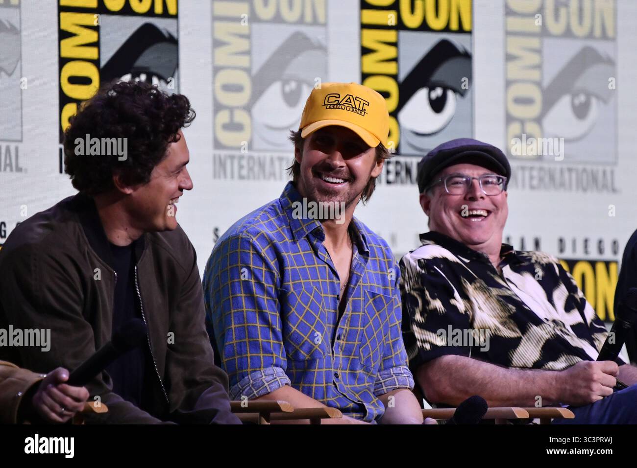 Director Phil Lord, Ryan Gosling, and Andy Weir attend a panel for ...