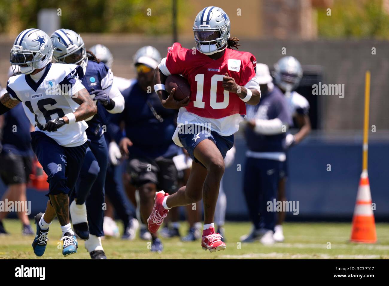 Dallas Cowboys quarterback Joe Milton III, right, runs ball during ...