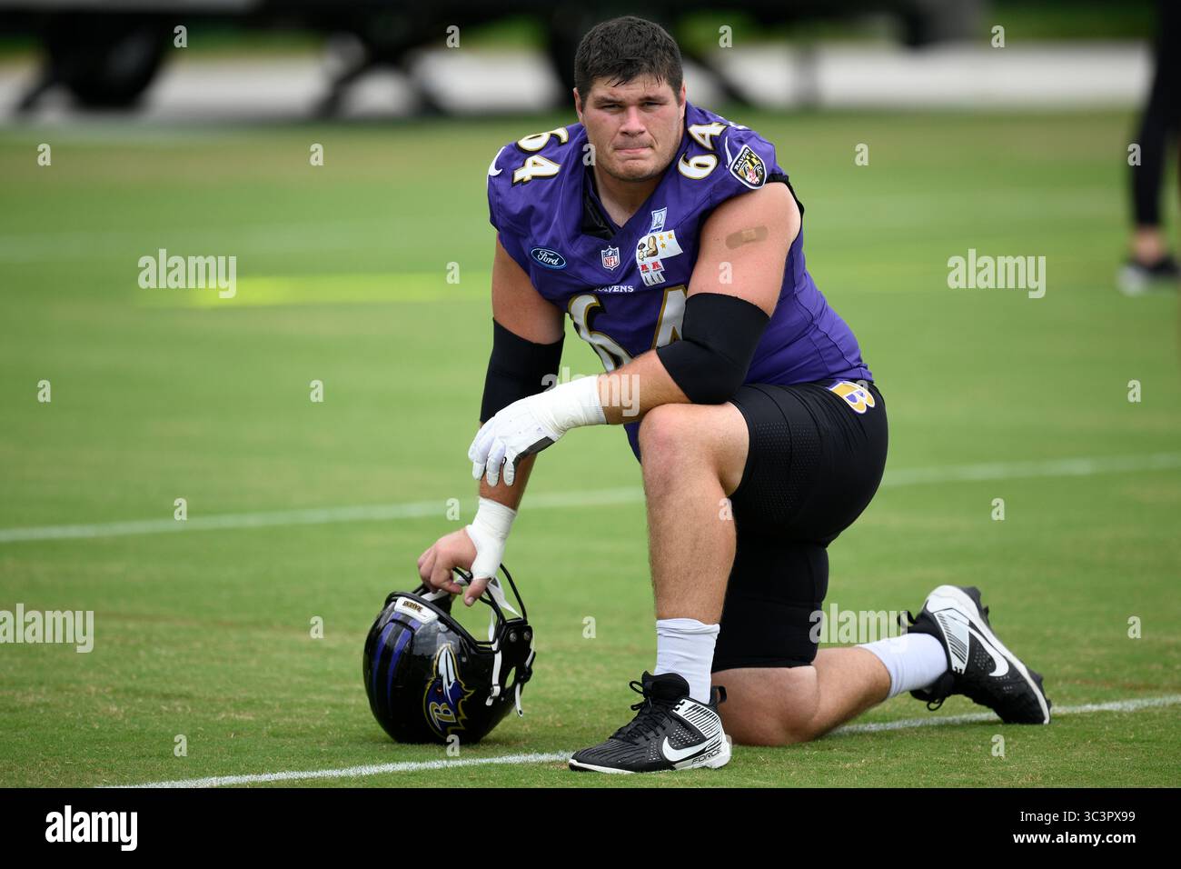 Baltimore Ravens center Tyler Linderbaum (64) works out during practice ...