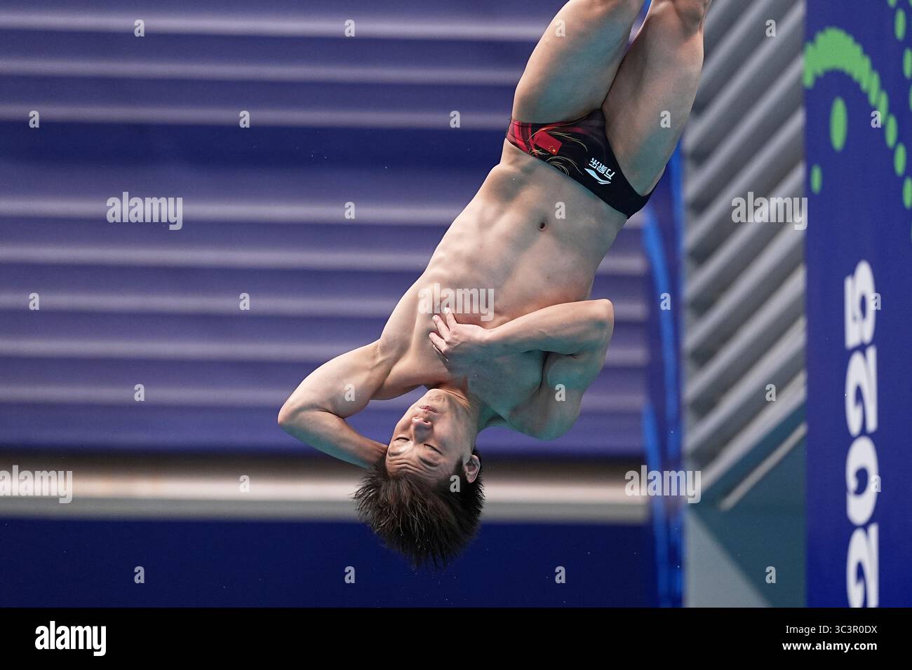 Zheng Jiuyuan of China competes in the men's 1m springboard diving ...