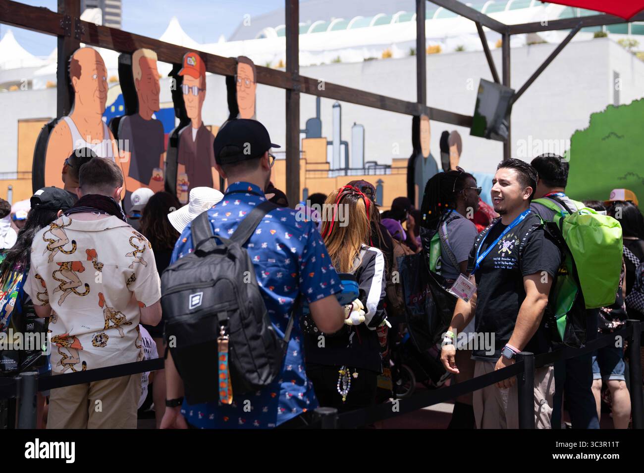 Fans line up to enter The King of the Hill activation zone outside the ...