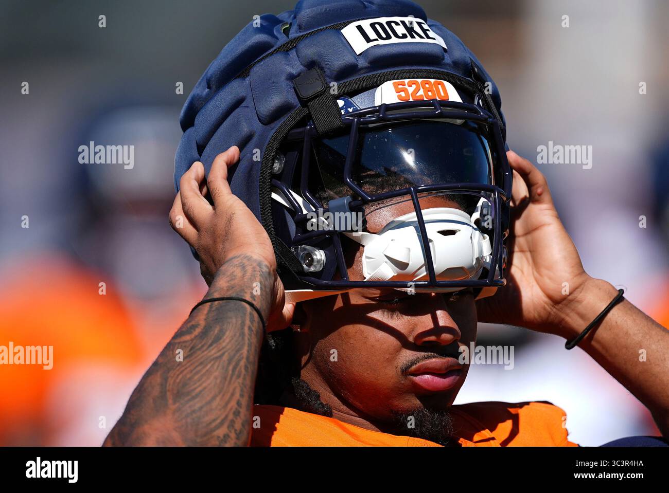 Denver Broncos safety P.J. Locke (6) warms up during Back Together ...