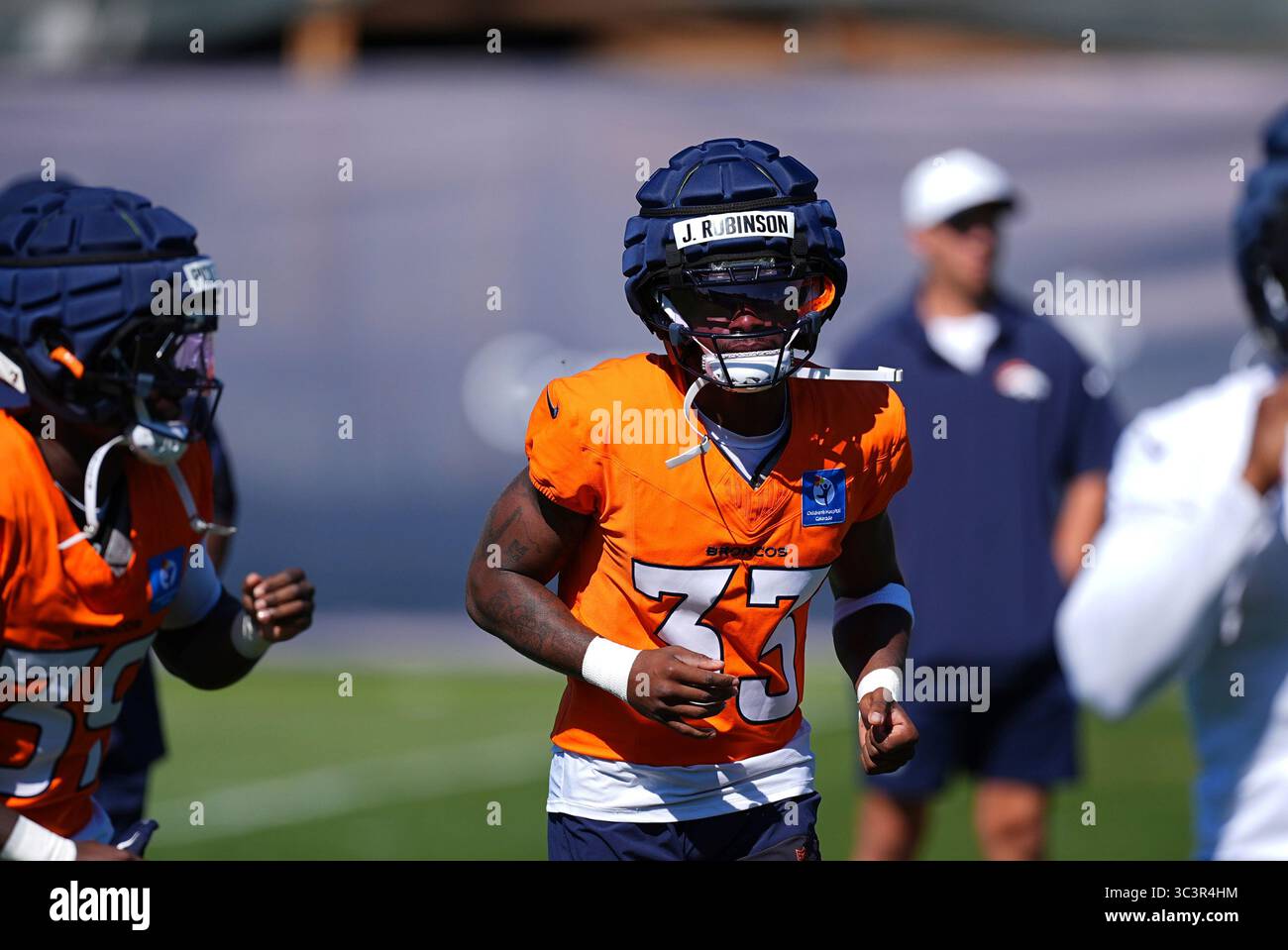 Denver Broncos rookie cornerback Jaen Robinson warms up during Back ...