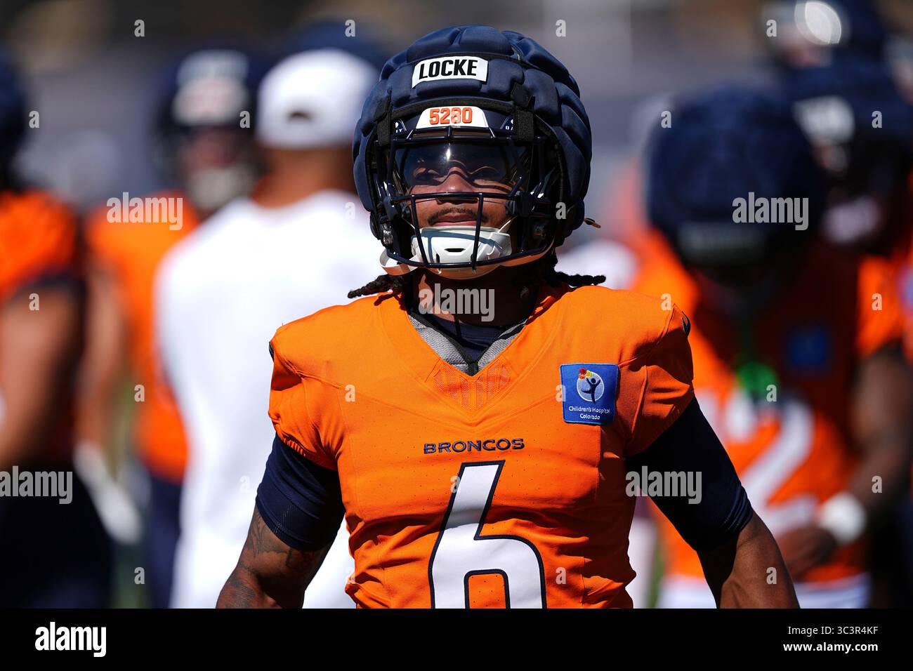 Denver Broncos safety P.J. Locke (6) warms up during Back Together ...