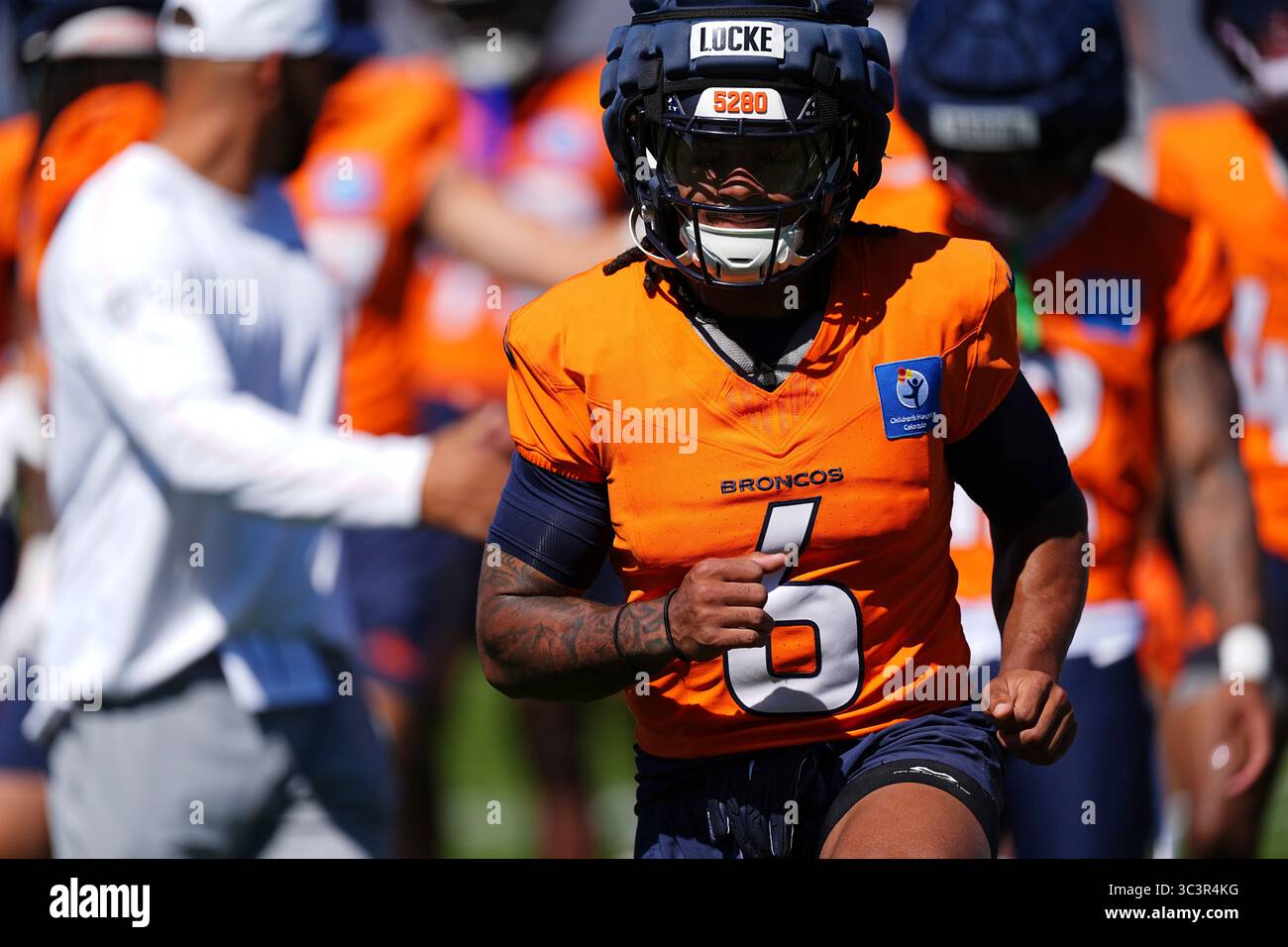 Denver Broncos safety P.J. Locke (6) warms up during Back Together ...