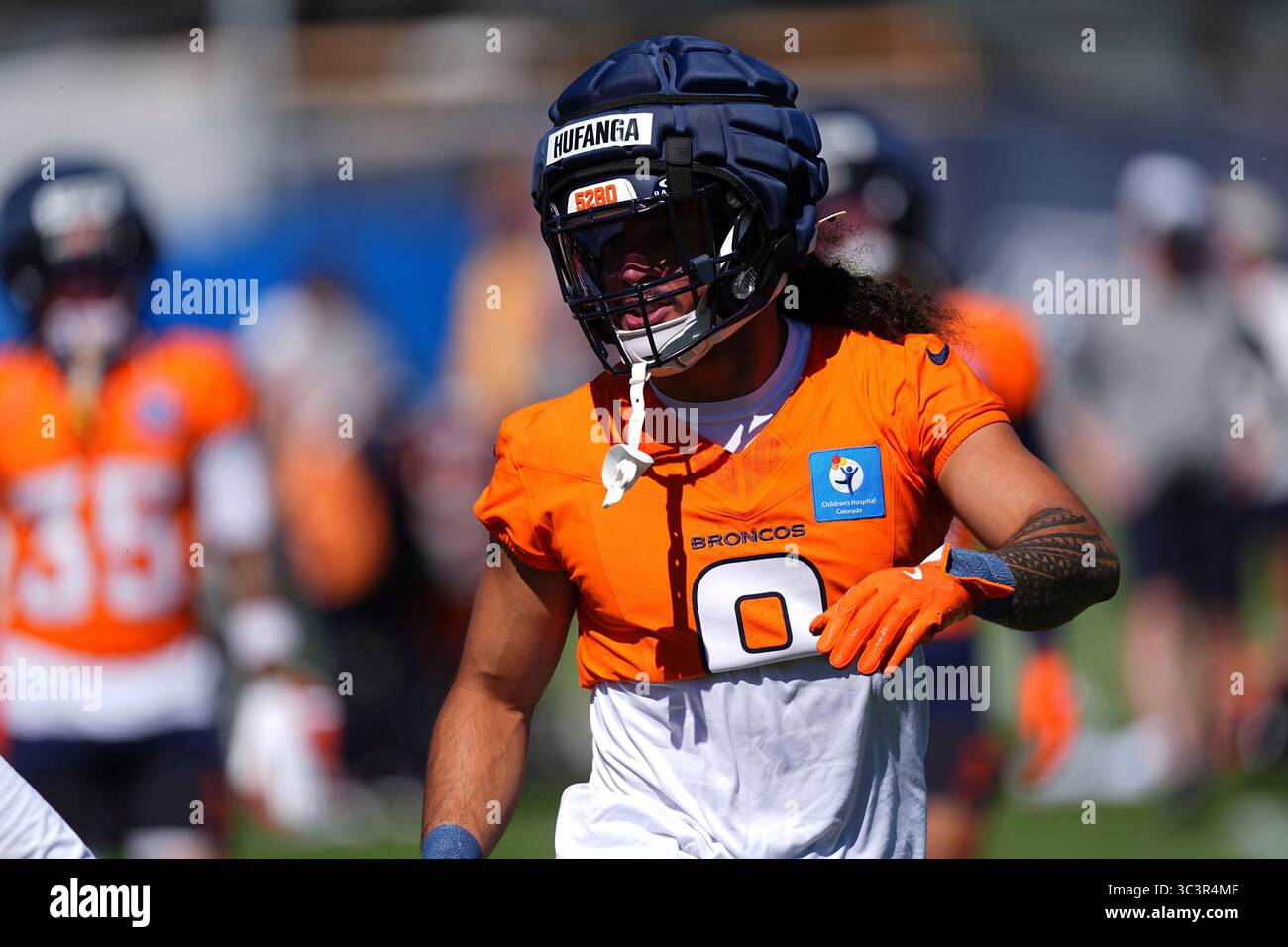 Denver Broncos safety Talanoa Hufanga (9) warms up during Back Together Weekend at an NFL ...