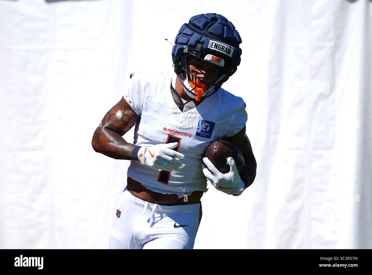 Denver Broncos tight end Evan Engram (1) warms up during Back Together ...