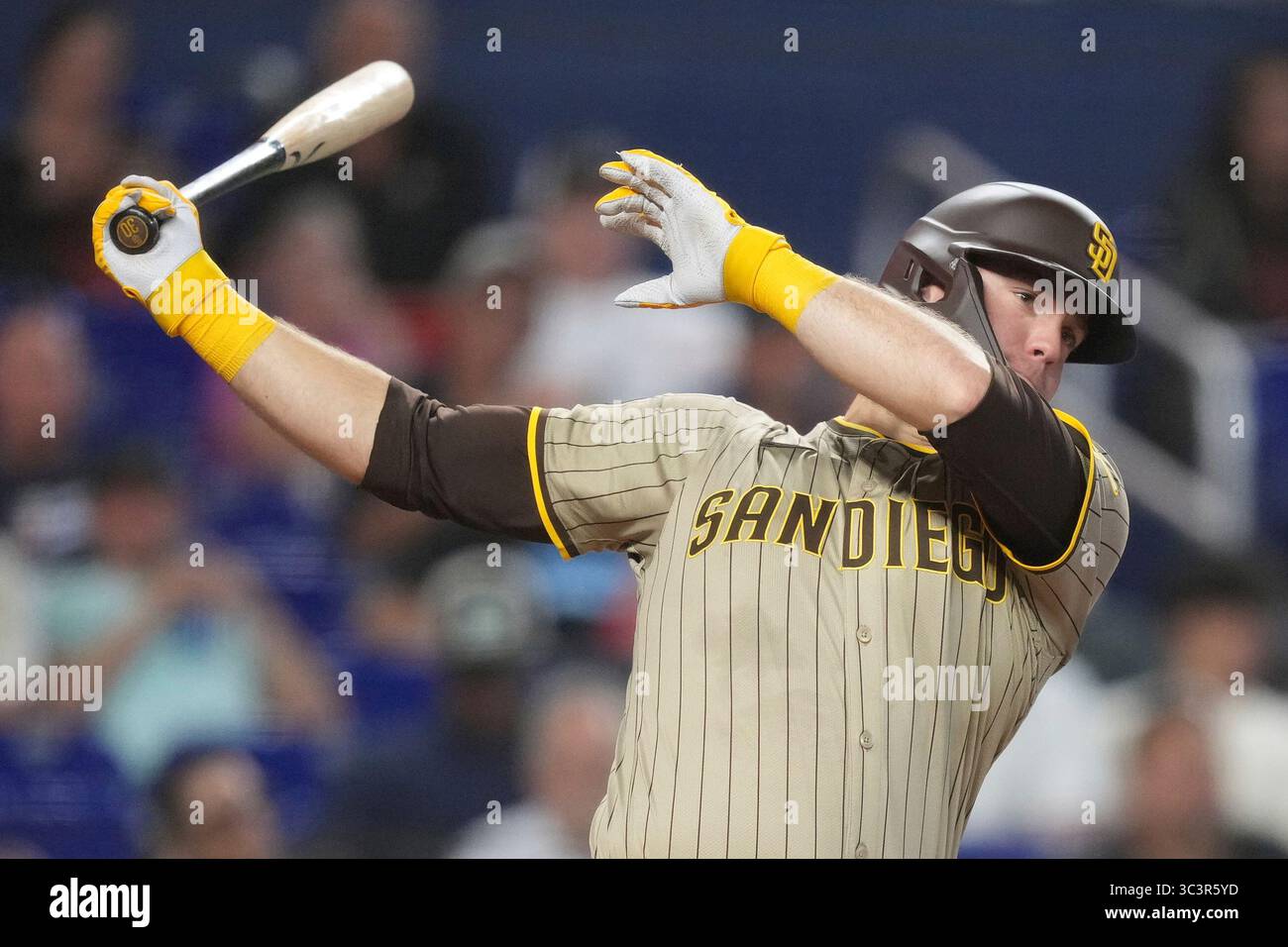 San Diego Padres' Gavin Sheets follows through on a swing in the fourth ...