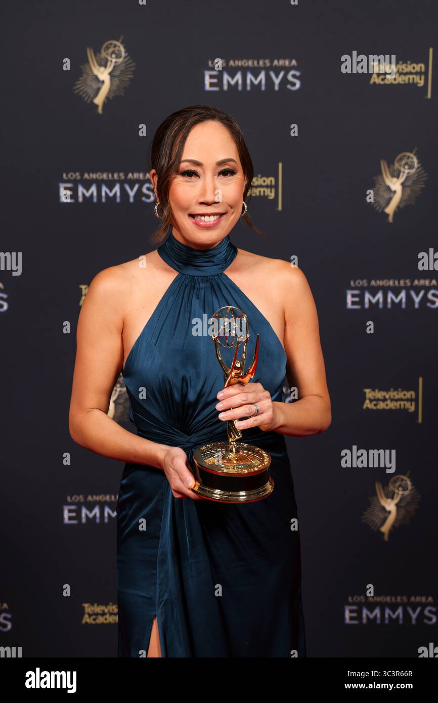 Renee Eng poses with the Human Interest News Story Emmy for Spectrum ...