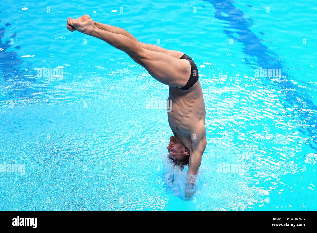 Tazman Abramowicz of Canada competes in the men's 1m springboard diving ...