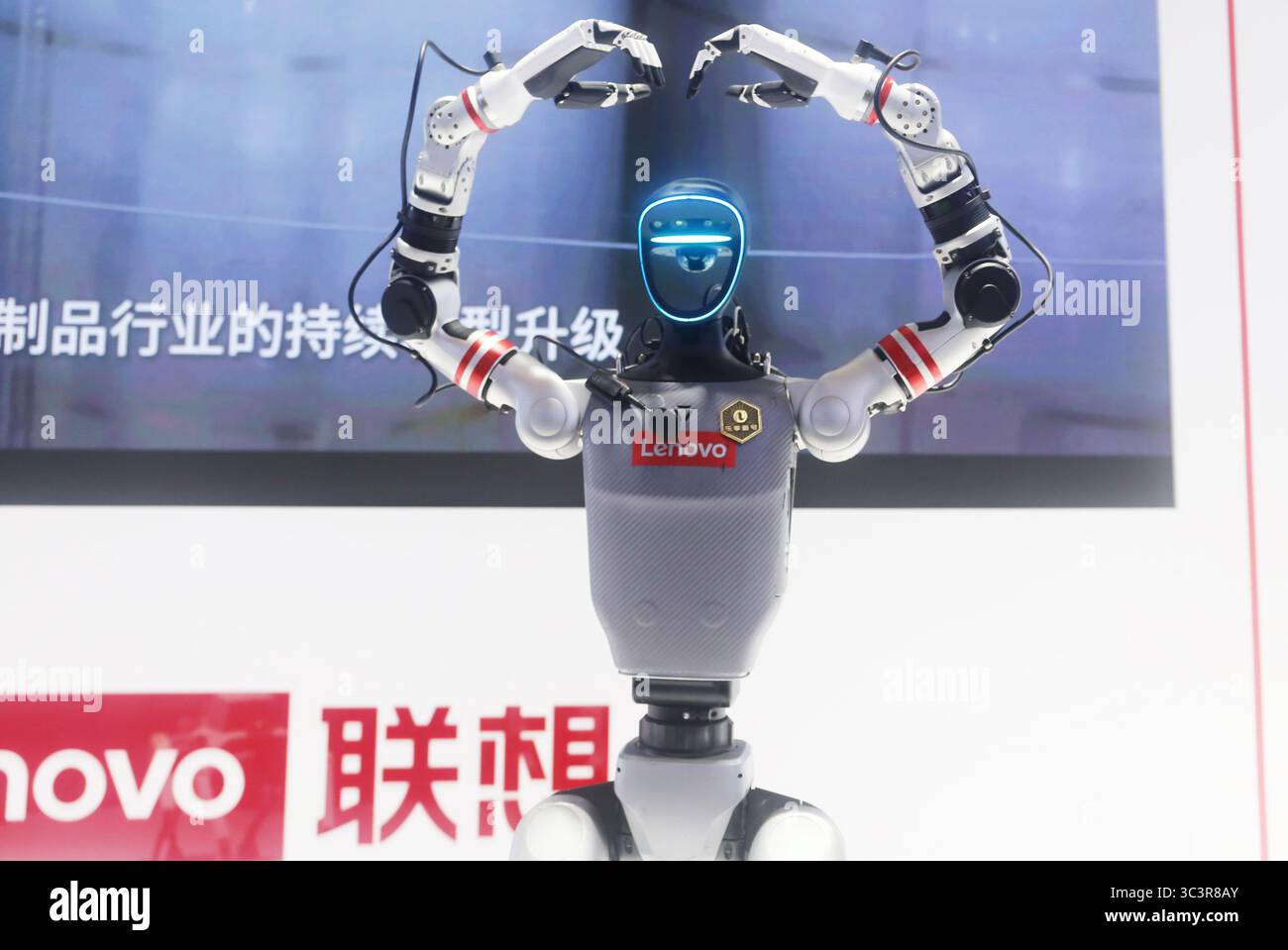 A Lenovo Group robot made a heart gesture at the 2025 WAIC World Artificial Intelligence ...