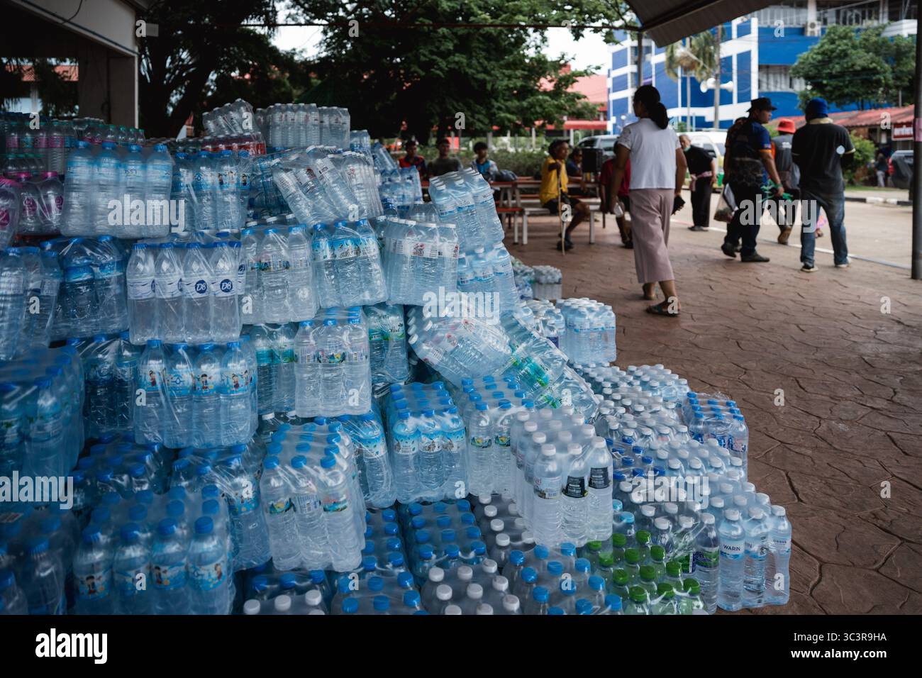 Stacks of bottled water are seen inside a temporary shelter prepared ...