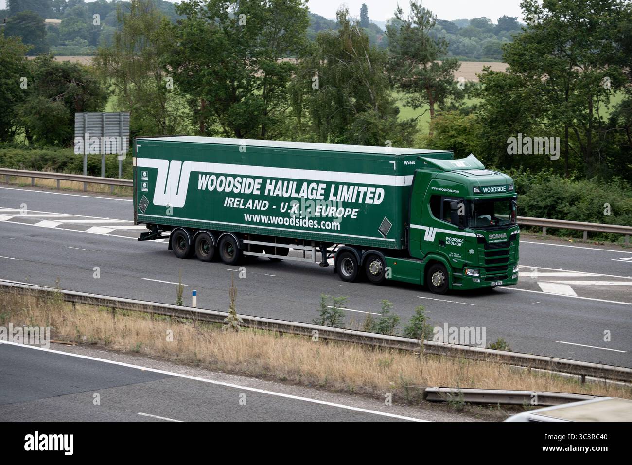 Woodside Haulage Limited lorry on the M40 motorway, Warwickshire, UK ...