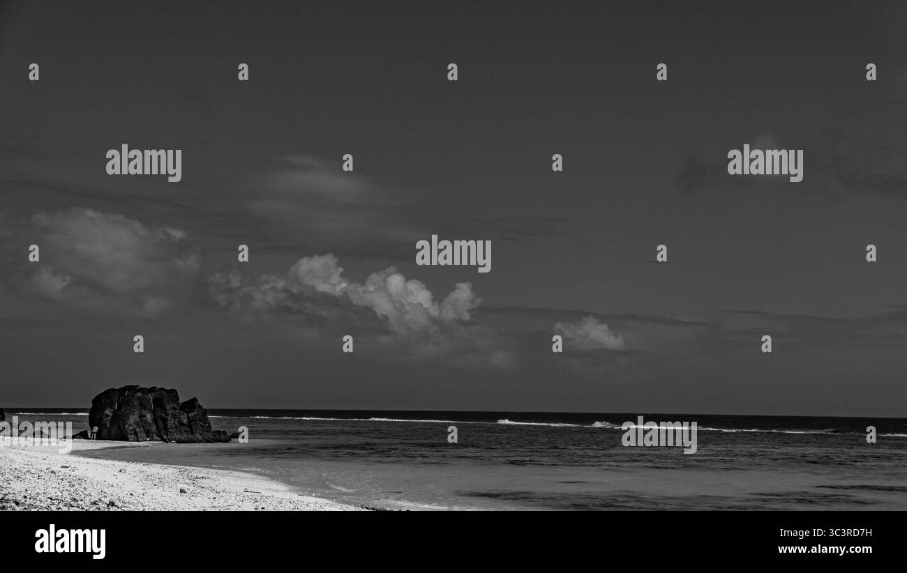 Giant rock on Tropical Island Stock Photo - Alamy