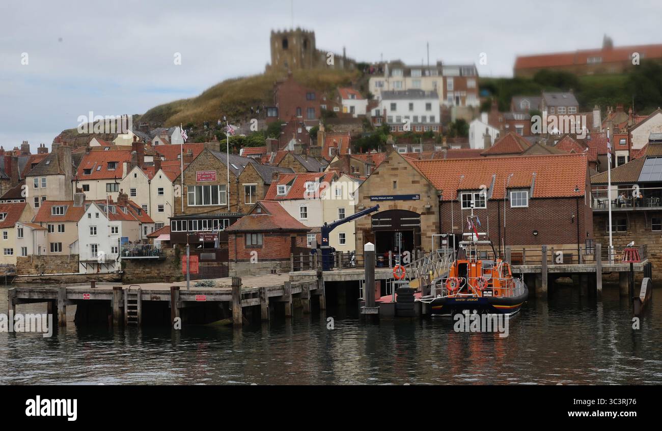 Bempton, UK. 22nd July, 2025. Whitby Abbey and Life boat East Cliff at ...