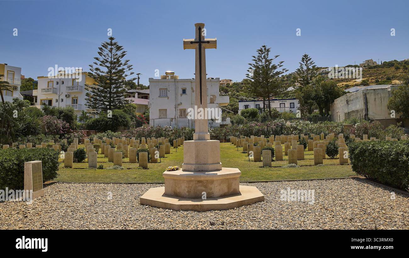 Large cross on a cemetery surrounded by gravestones and trees, Military ...