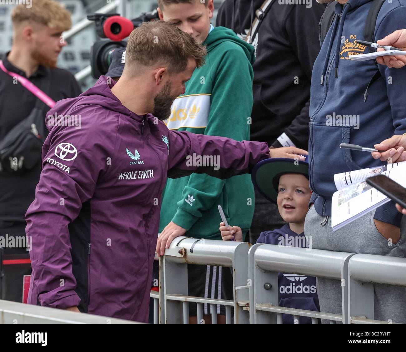 Ben Duckett of England greats a young England fan during the 4th ...