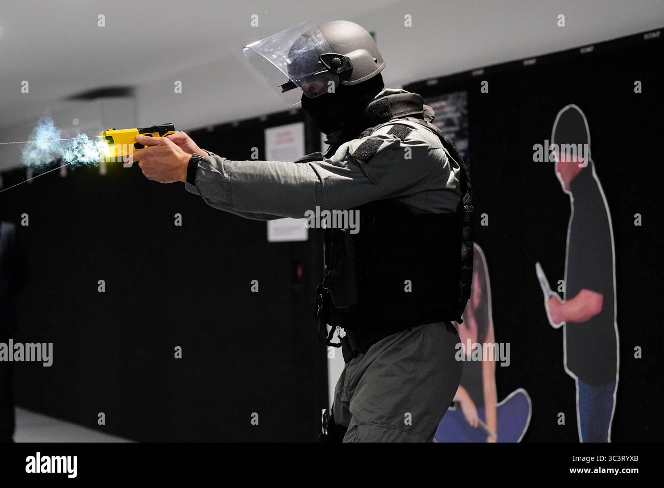 EMBARGOED TO 0001 MONDAY JULY 28 A taser demonstration during the ...