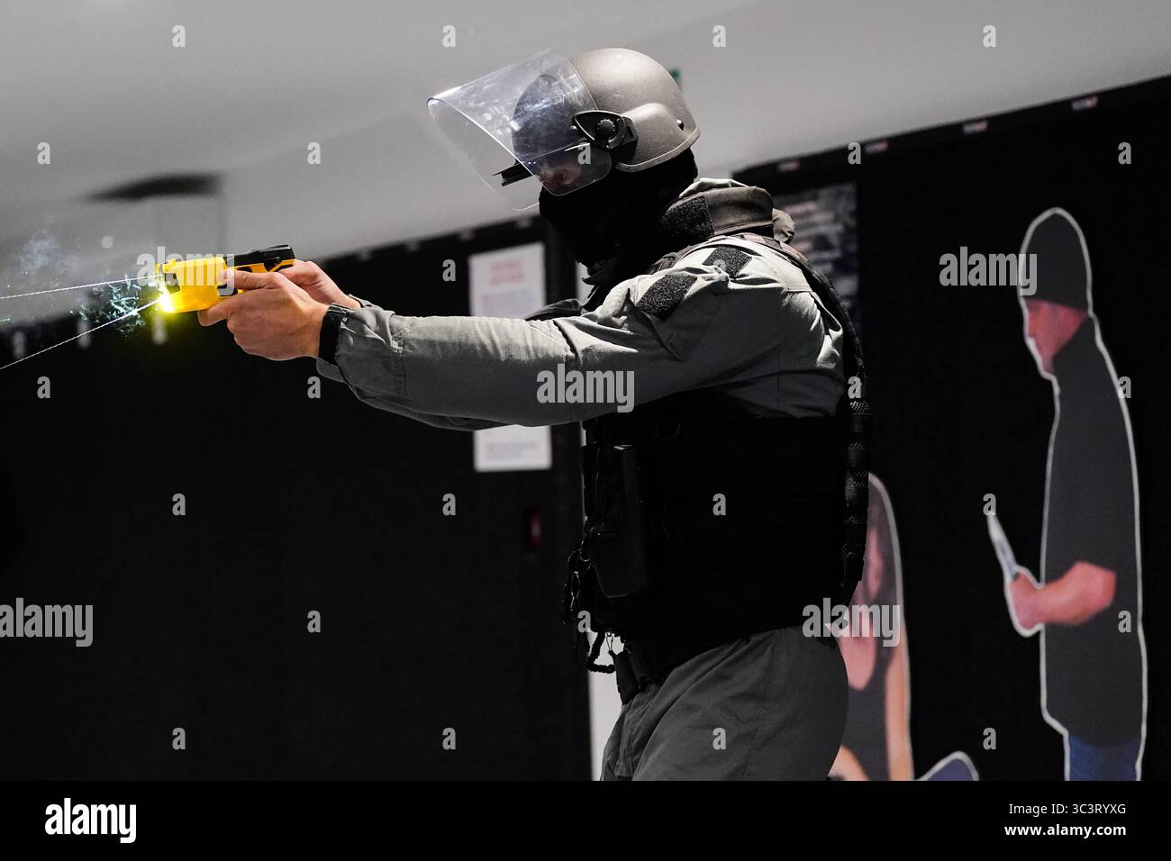 EMBARGOED TO 0001 MONDAY JULY 28 A taser demonstration during the ...