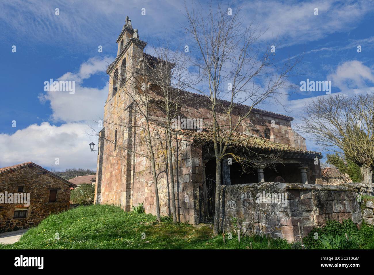 Medieval stone church with bell gable and rustic surroundings in a ...