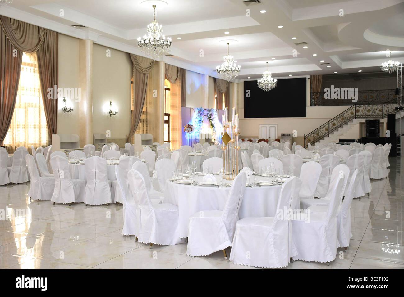 Large spacious light banquet hall at a wedding. Wedding banquet hall ...