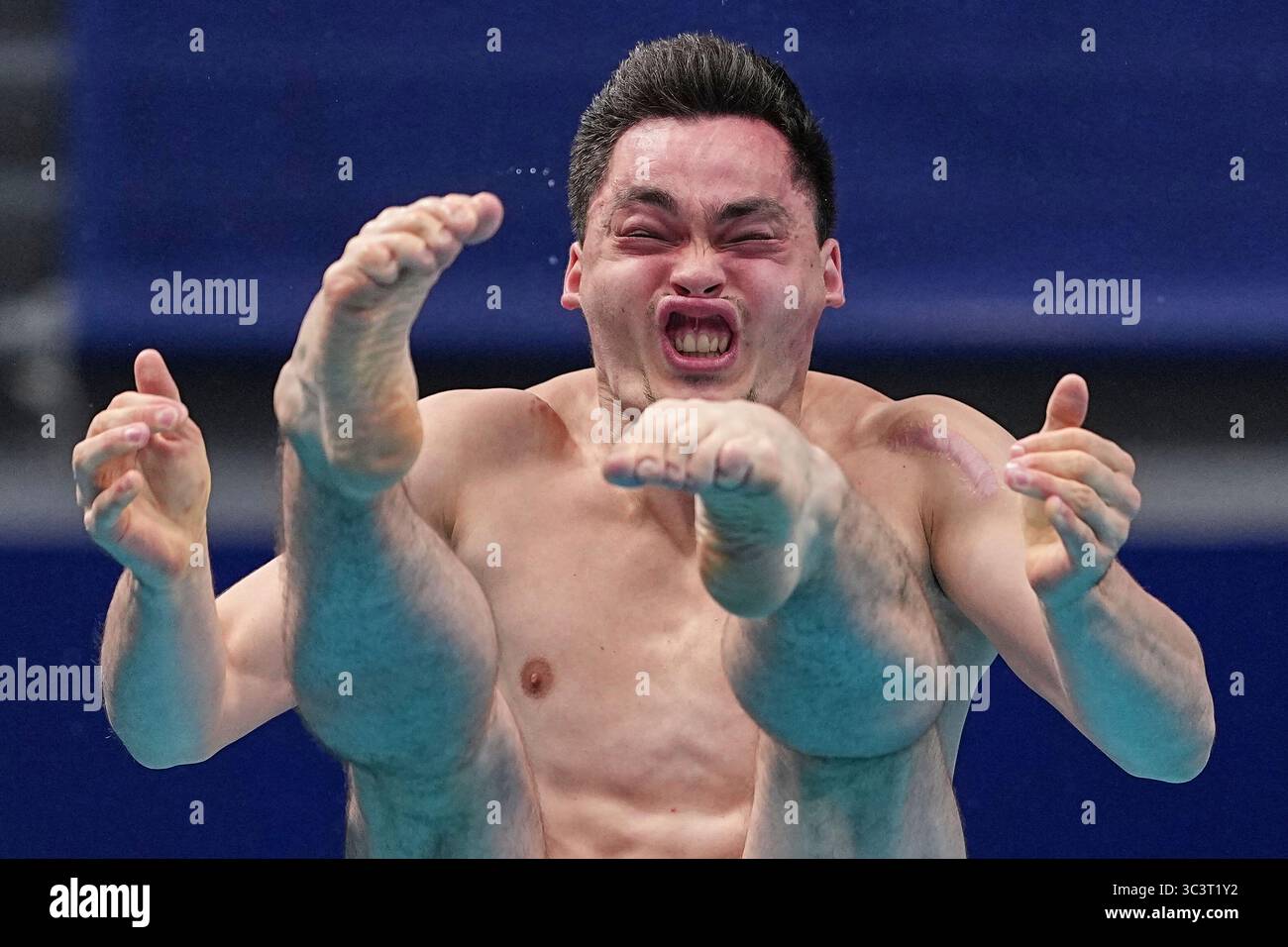 Lou Massenberg of Germany competes in the men's 1m springboard diving ...