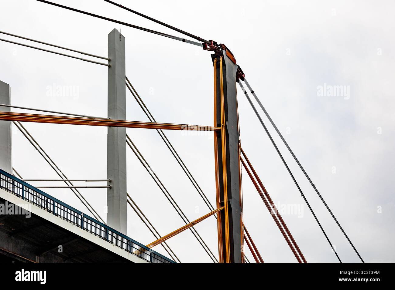 Cables and electrical wires are being lifted by a crane during the ...