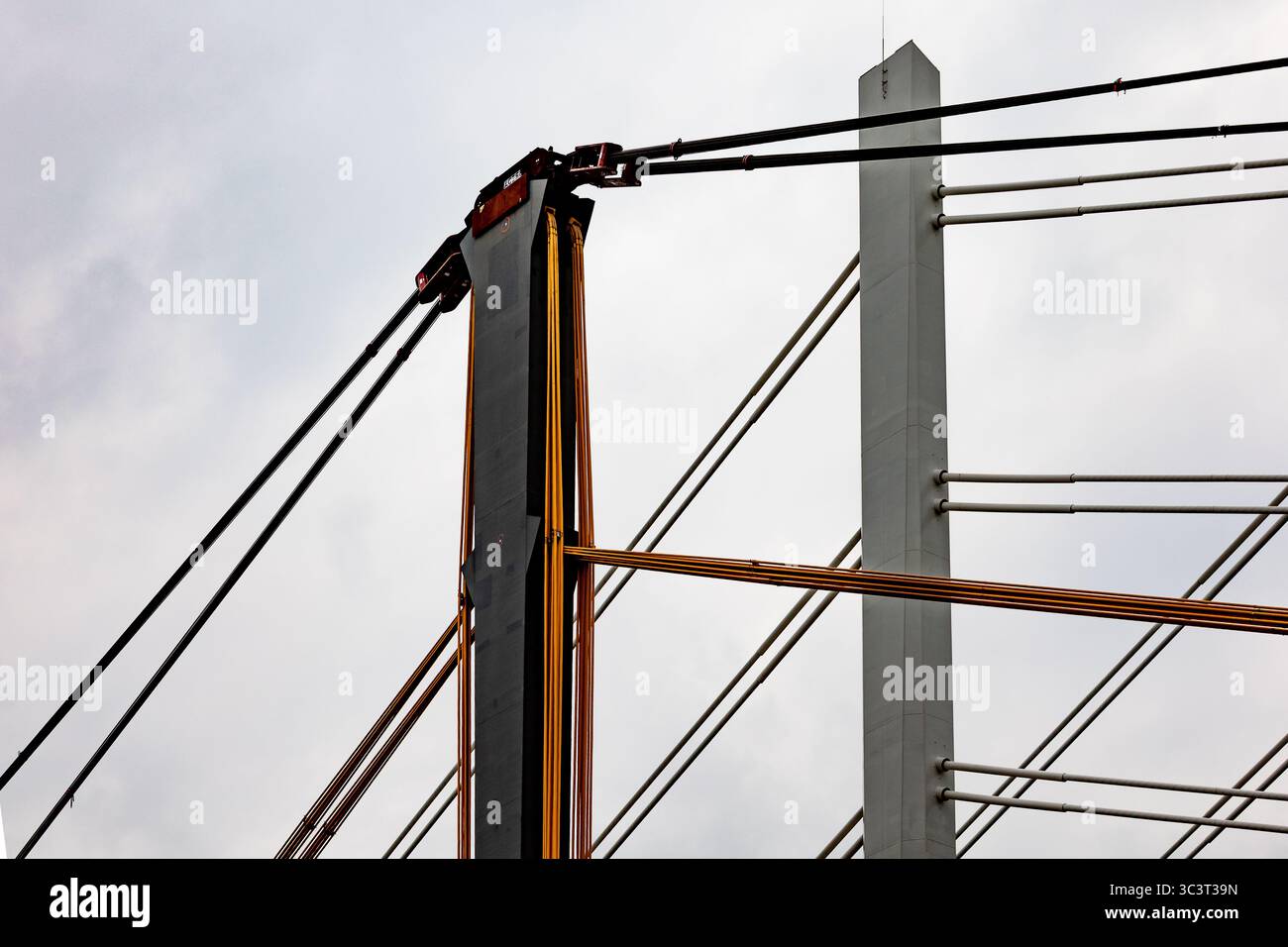 Cables and electrical wires are being lifted by a crane during the ...