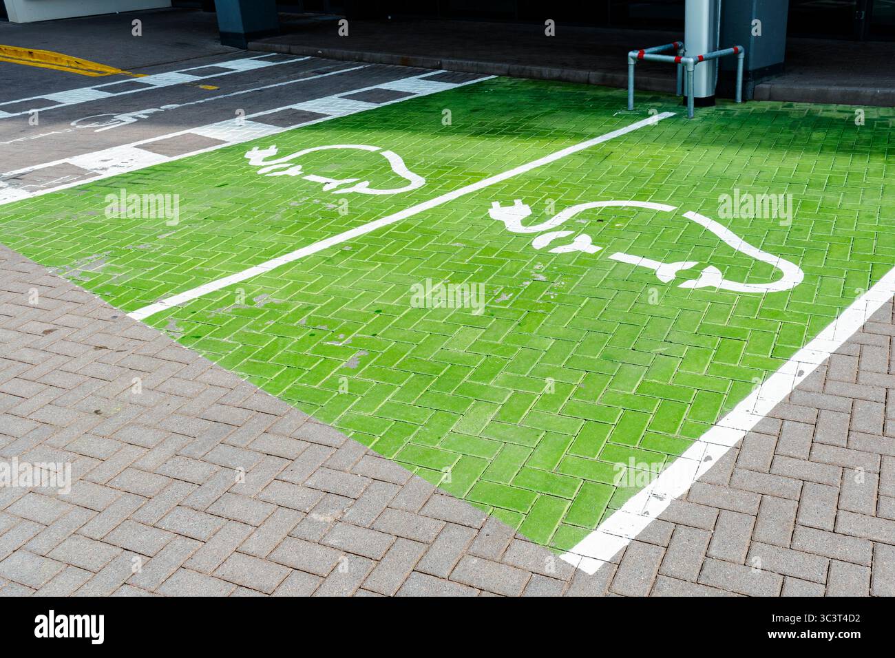 Charging stations and parking spots in a designated parking area with ...