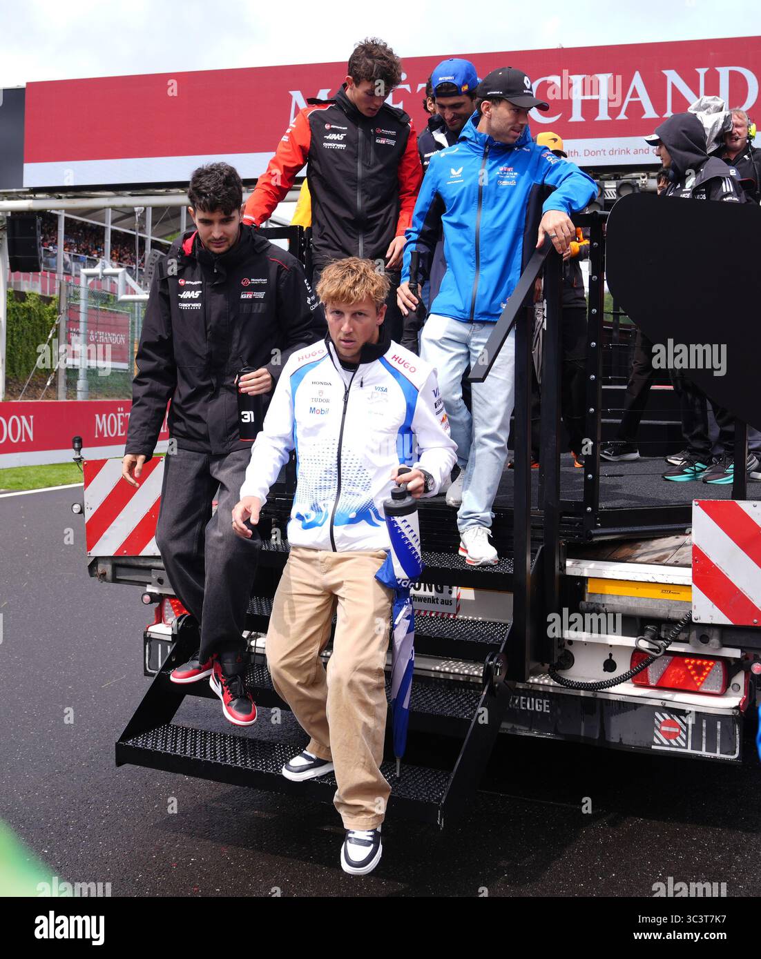 Racing Bulls' Liam Lawson (center) and racers during a parade ahead of ...
