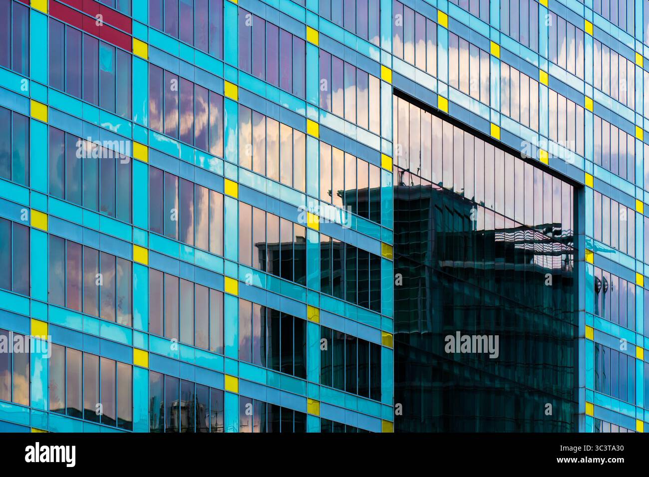 Sky blue glass facade with grid-like window divisions Stock Photo - Alamy