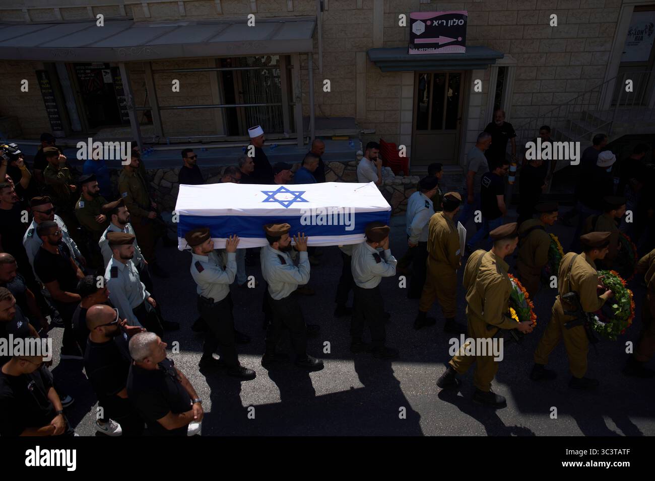 Israeli soldiers carry the coffin of Druze Israeli captain Amir Saad ...