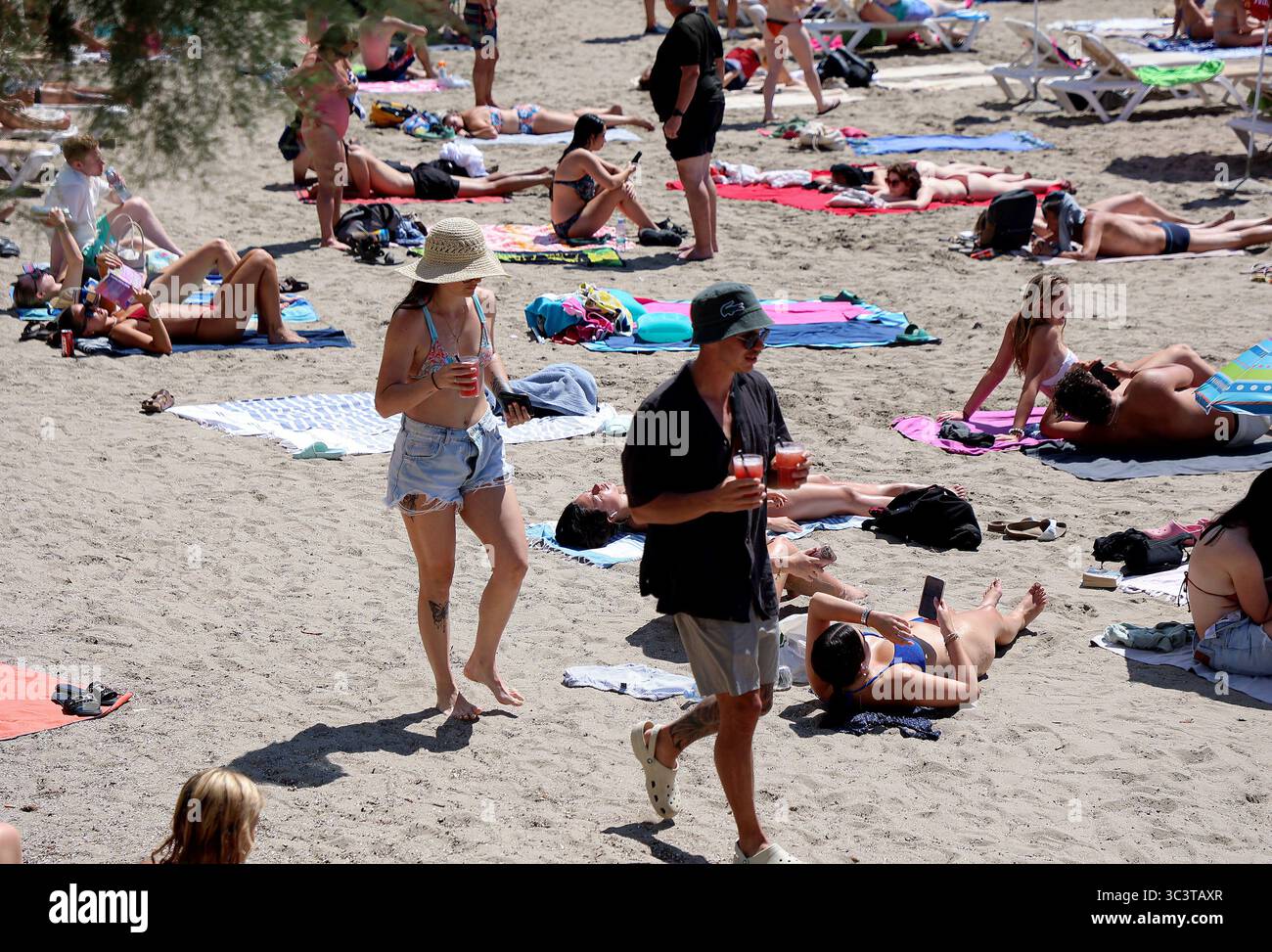 People enjoy swimming and sunbathing on the beach bacvice in split, croatia on july 27, 2025. hi ...