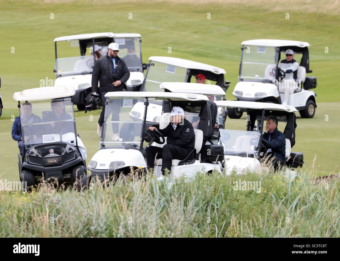 Ayr, UK. 27th July, 2025. American President Donald Trump drives his ...