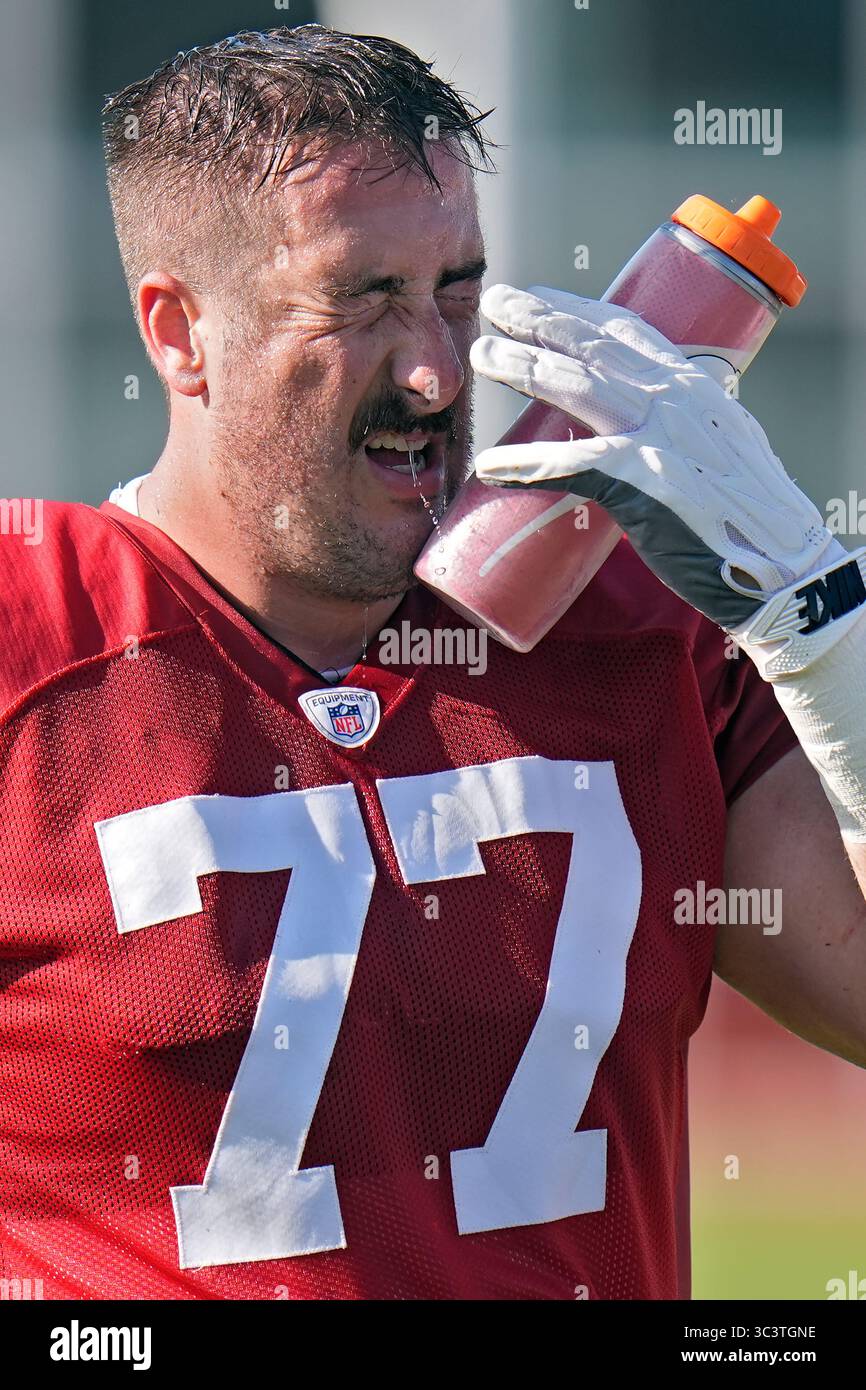 Tampa Bay Buccaneers offensive tackle Charlie Heck wipes away sweat ...