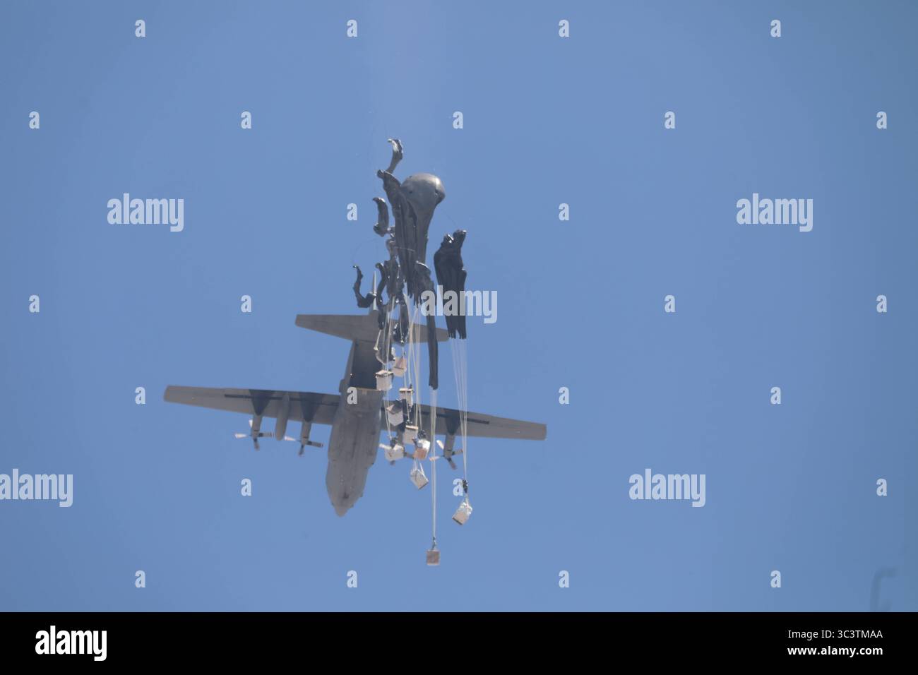 An airplane drops humanitarian aid over Gaza An airplane drops ...
