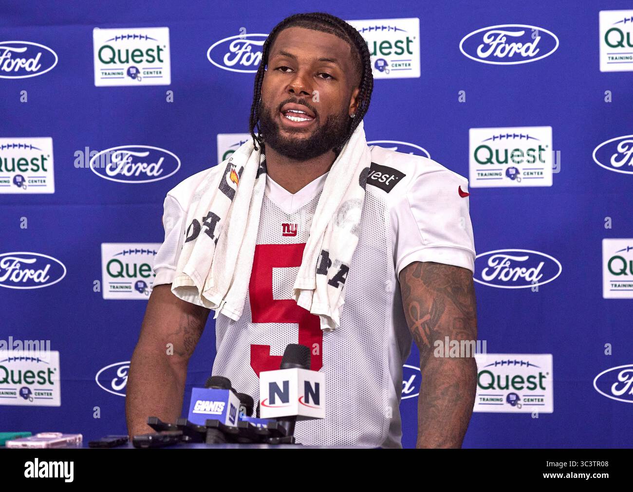 New York Giants linebacker Kayvon Thibodeaux (5) talks with media ...