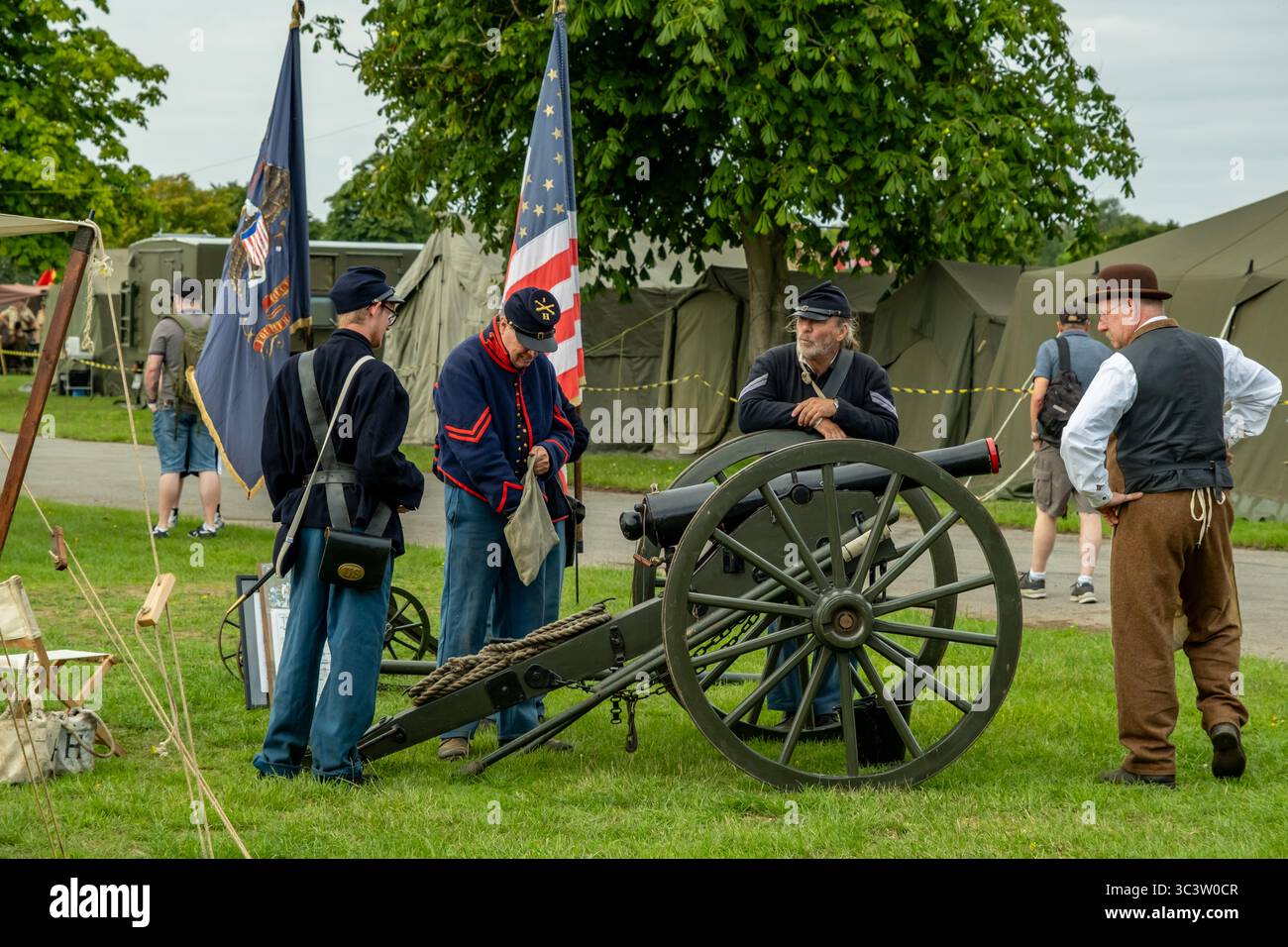 A group of men dressed up as Confederate States Army soldiers next to a ...