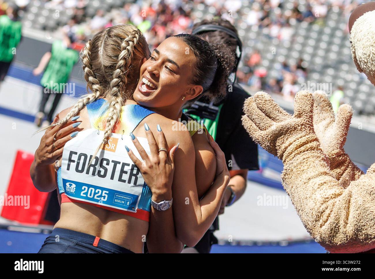 Viktoria Forster from Slovakia, left, congratulates Ditaji Kambundji ...