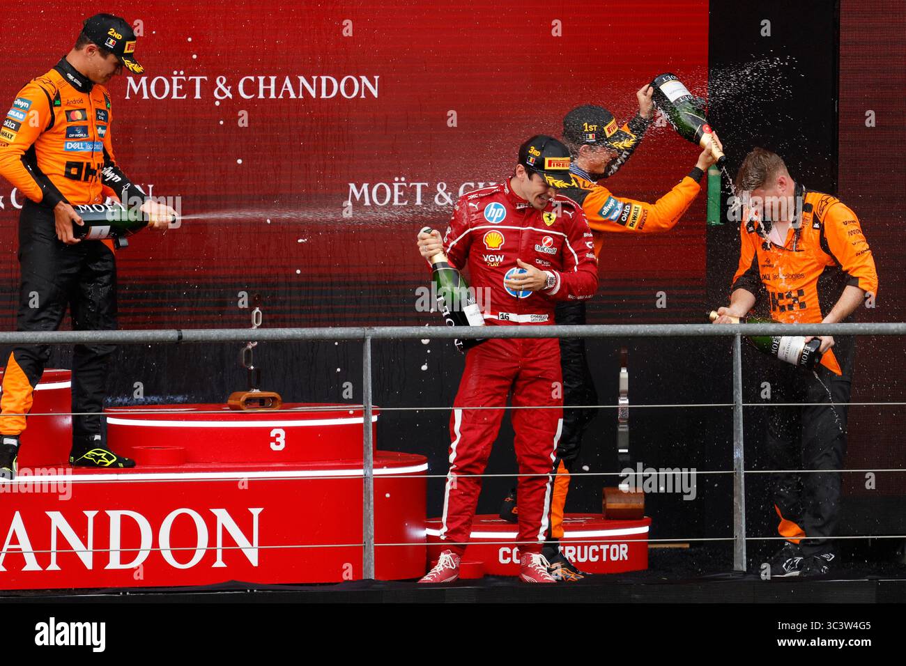 First place, McLaren driver Oscar Piastri of Australia, second right ...