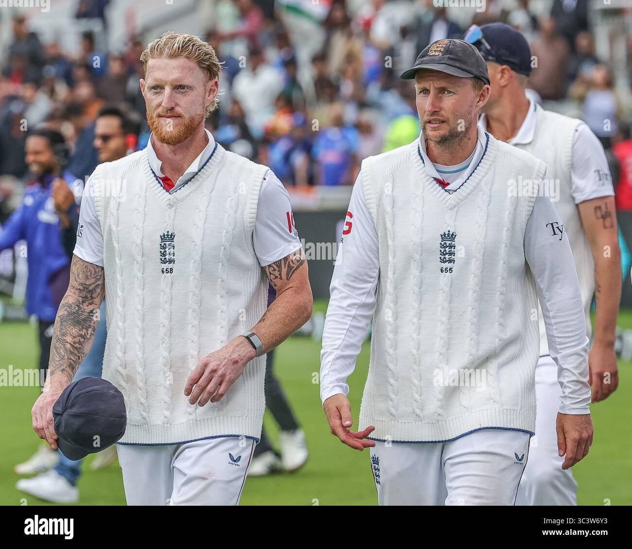 England captain Ben Stokes and Joe Root of England leave the field of ...