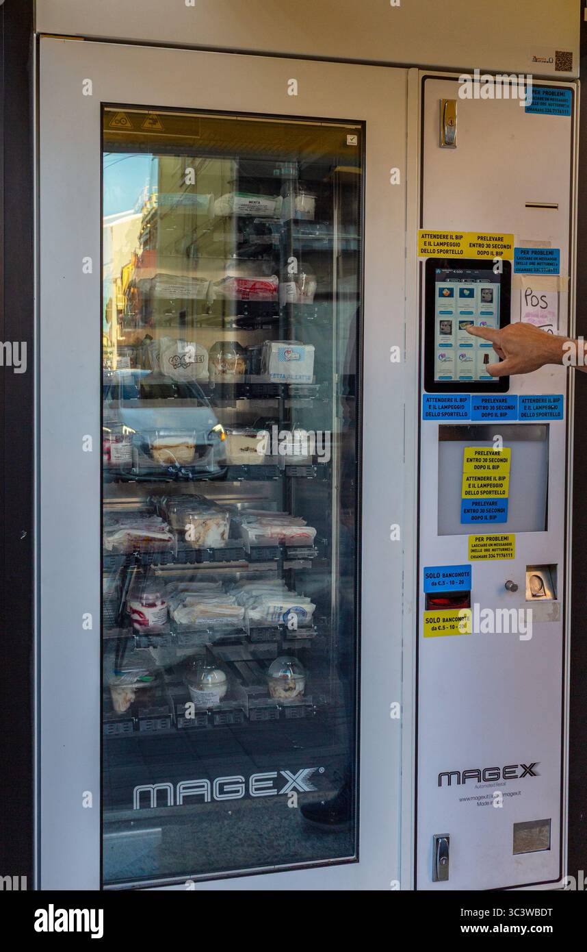 Sottomarina , Italy - May 25, 2025: A man's hand presses the touchpad ...