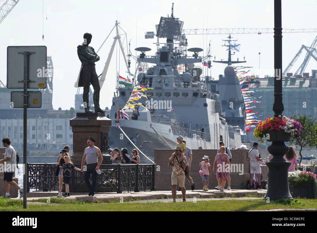 People walk past the INS Tamal (F71) frigate of the Indian Navy, moored ...