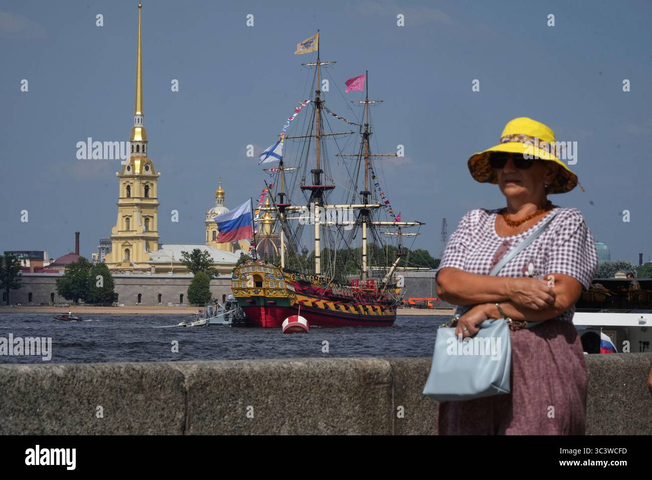 A woman walks past the "Poltava", a modern copy of the Russian 54-gun ...