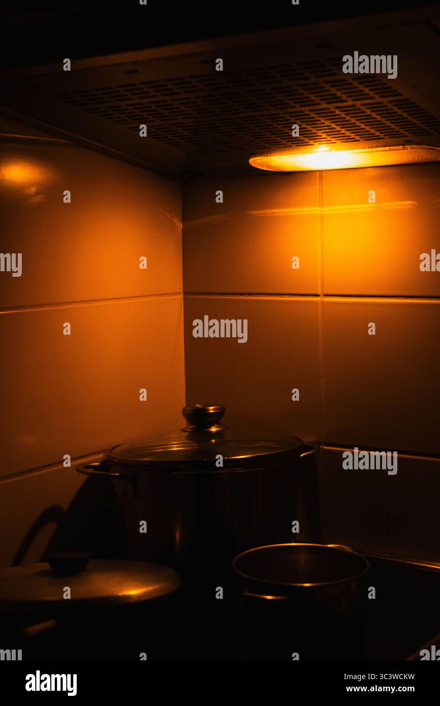 Evening Kitchen Warmth with Soft Light Above Stove, vertical Stock ...