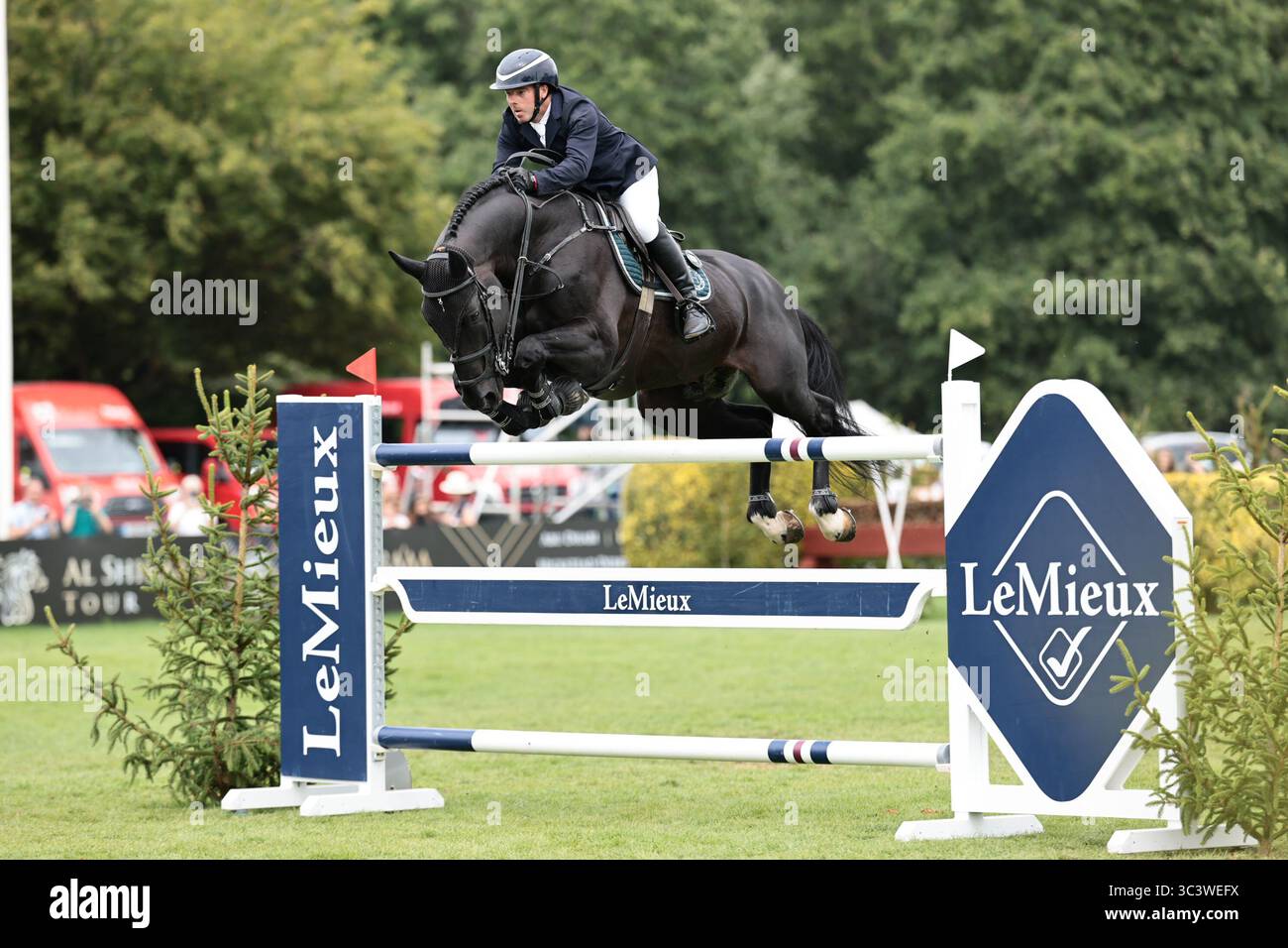 Robert Whitaker of Great Britain riding Vermento during the first round ...